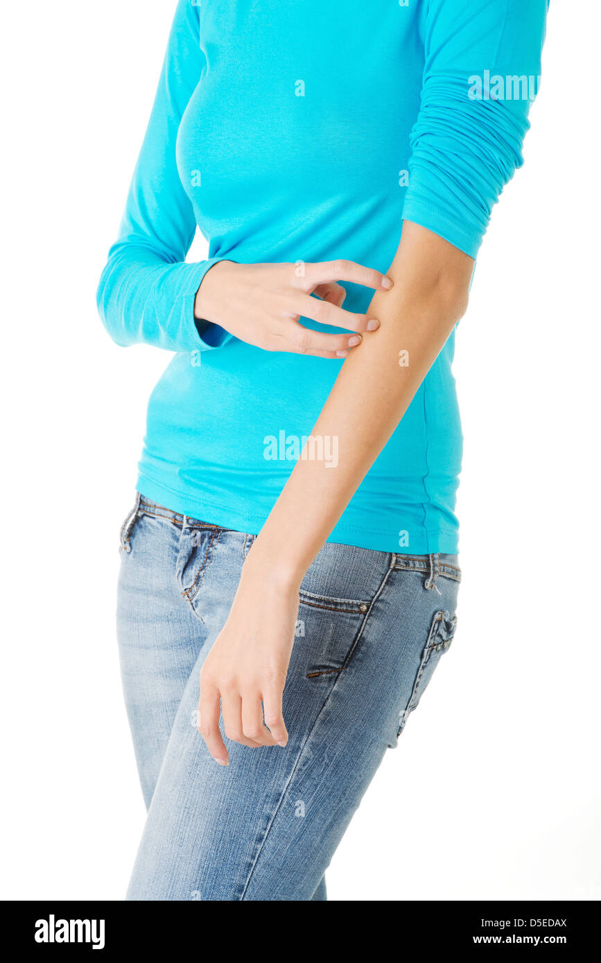 Young woman scratching her self. Isolated on white Stock Photo - Alamy