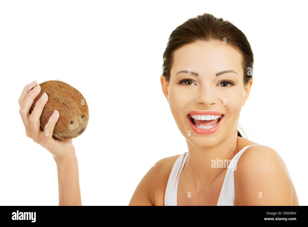 Beautiful woman with coconut in hands over white background Stock Photo ...