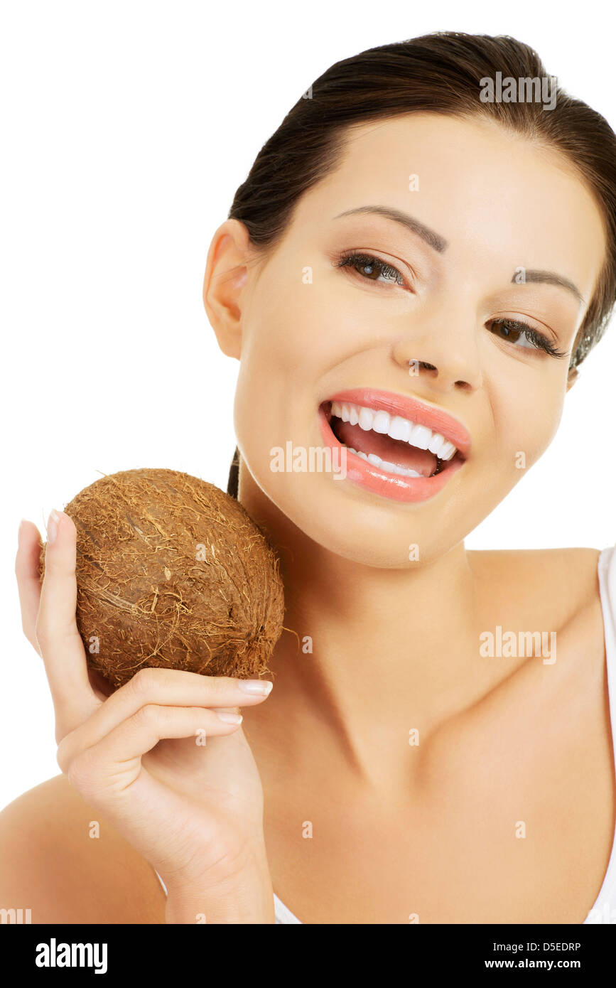 Beautiful woman with coconut in hands over white background Stock Photo ...