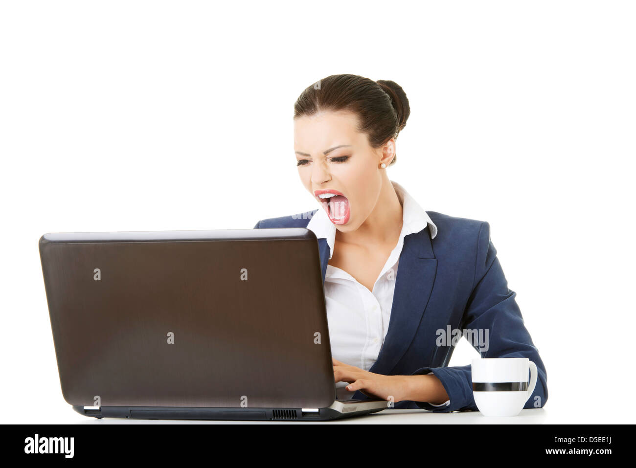 Angry businesswoman shouting on her laptop, isolated on white Stock ...