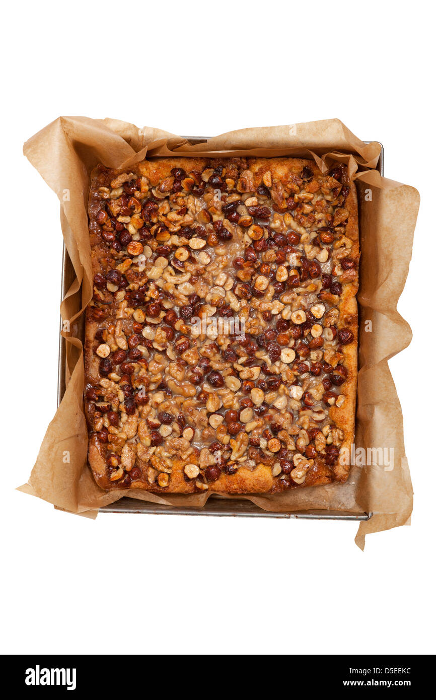 nut cake in baking tray isolated on white background Stock Photo - Alamy