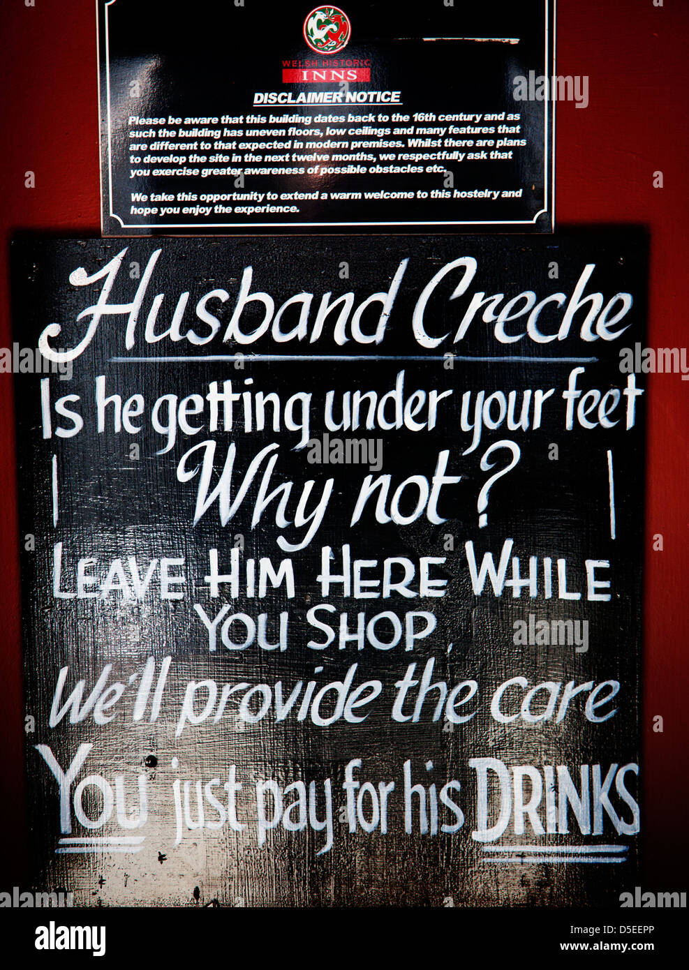 Man Creche Husband Creche sign in pub doorway Caernarfon Gwynedd Wales ...