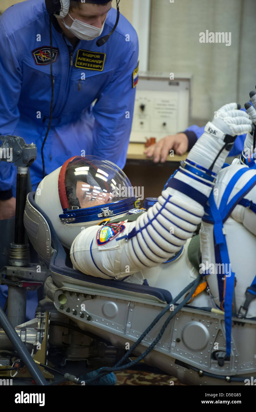 Expedition 35 NASA Flight Engineer Chris Cassidy has his Russian Sokol ...