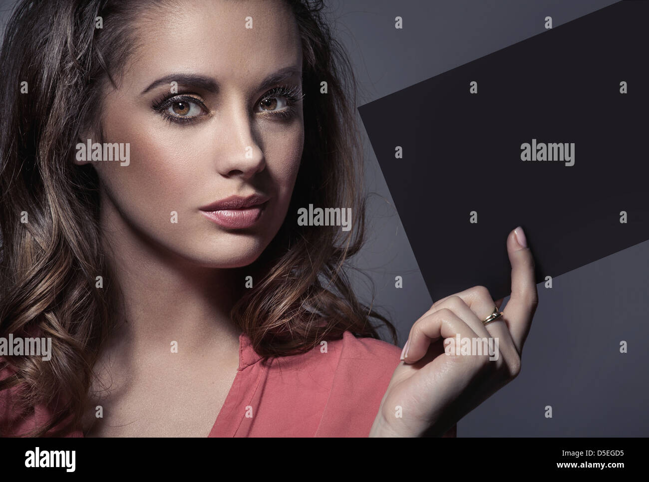 Smart lady holding an empty sheet Stock Photo - Alamy