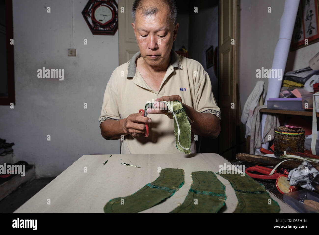 Artisan making shoes for "bound feet", Melaka, Malaysia, Asia Stock ...