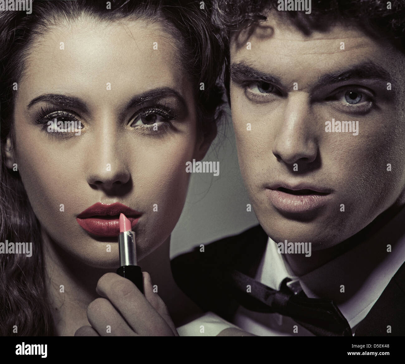 Attractive young couple opposite the mirror Stock Photo - Alamy