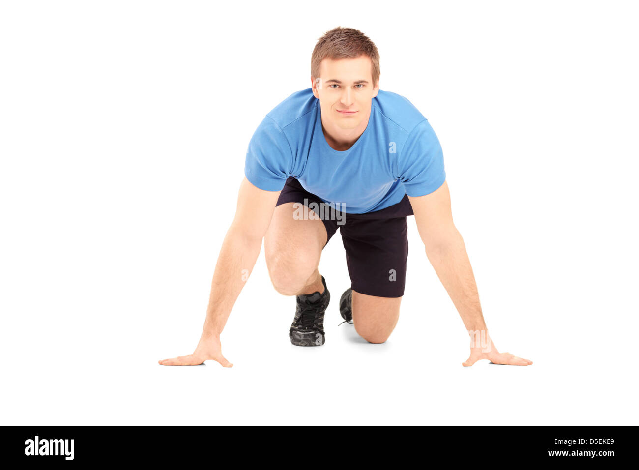 A male athlete ready to run isolated on white background Stock Photo ...