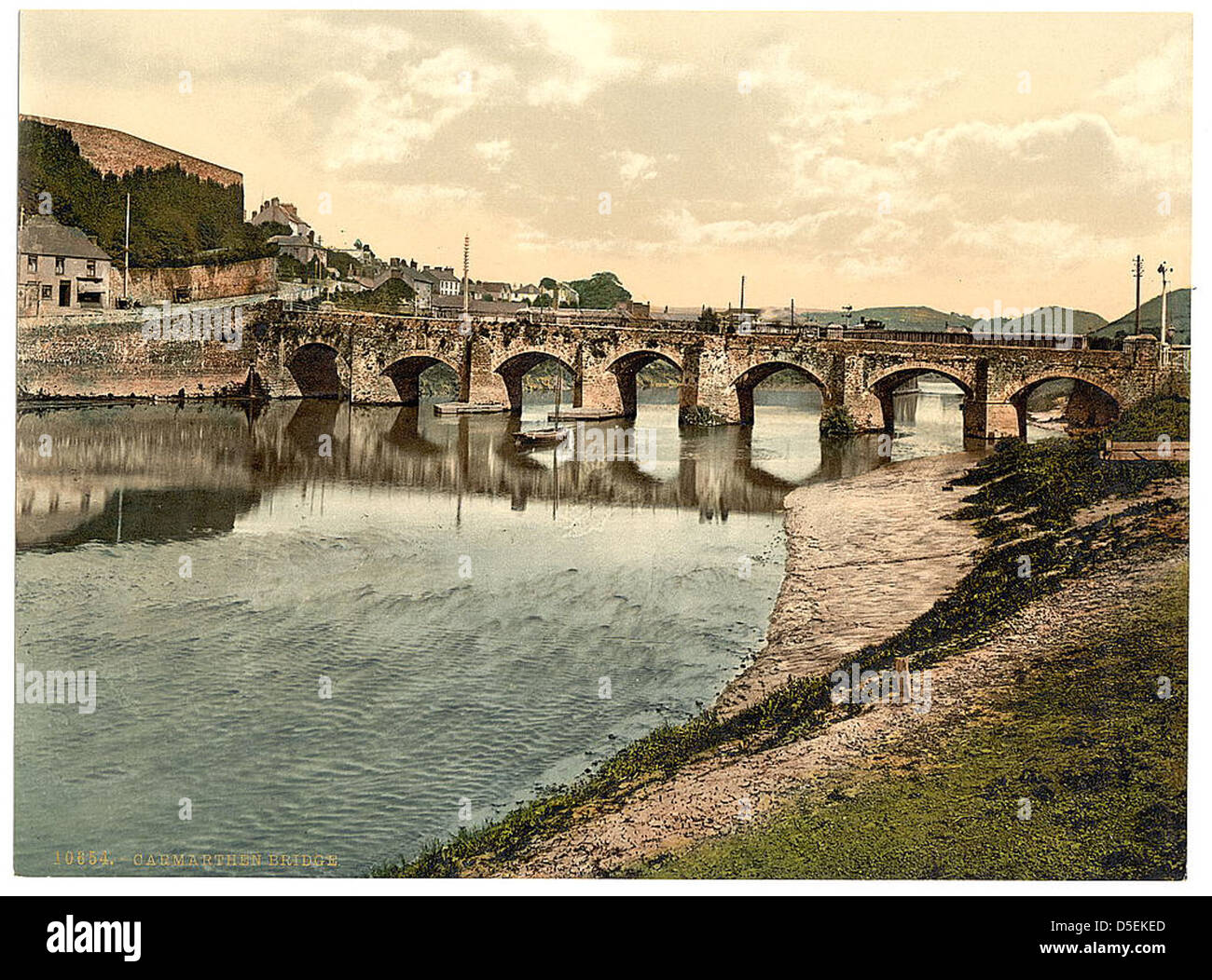 This photograph features a bridge in Carmarthen, Wales, spanning the ...