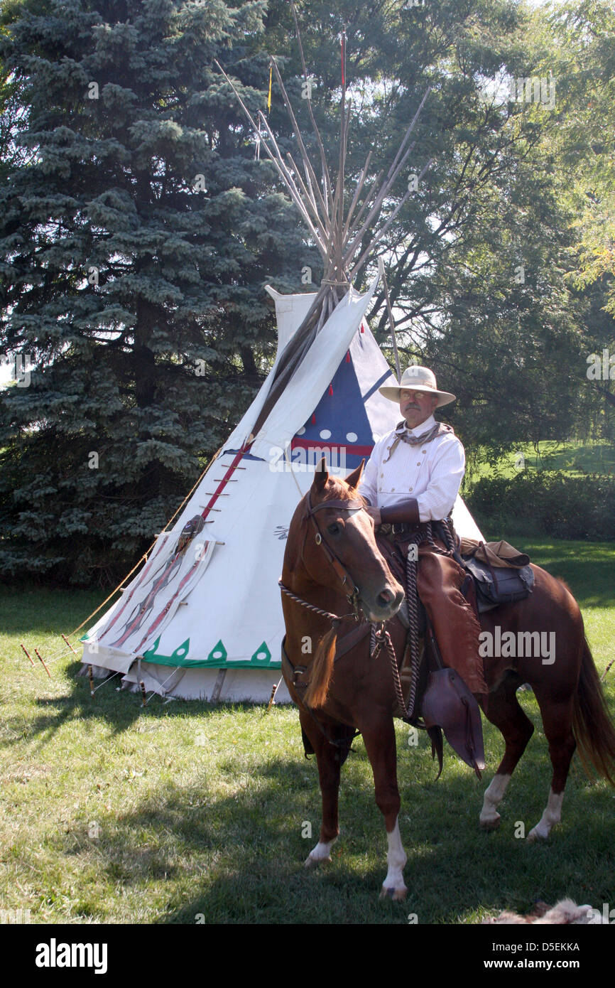 A cowboy in front of a Native American Indian tipi Stock Photo - Alamy