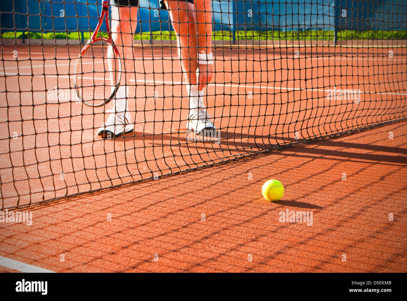 playing tennis on clay course Stock Photo - Alamy