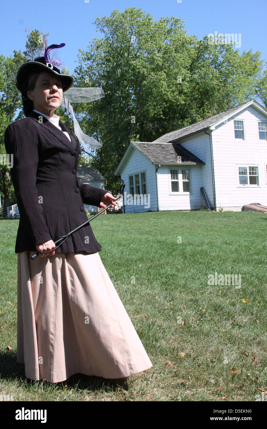 A lady standing in front of her house Stock Photo - Alamy