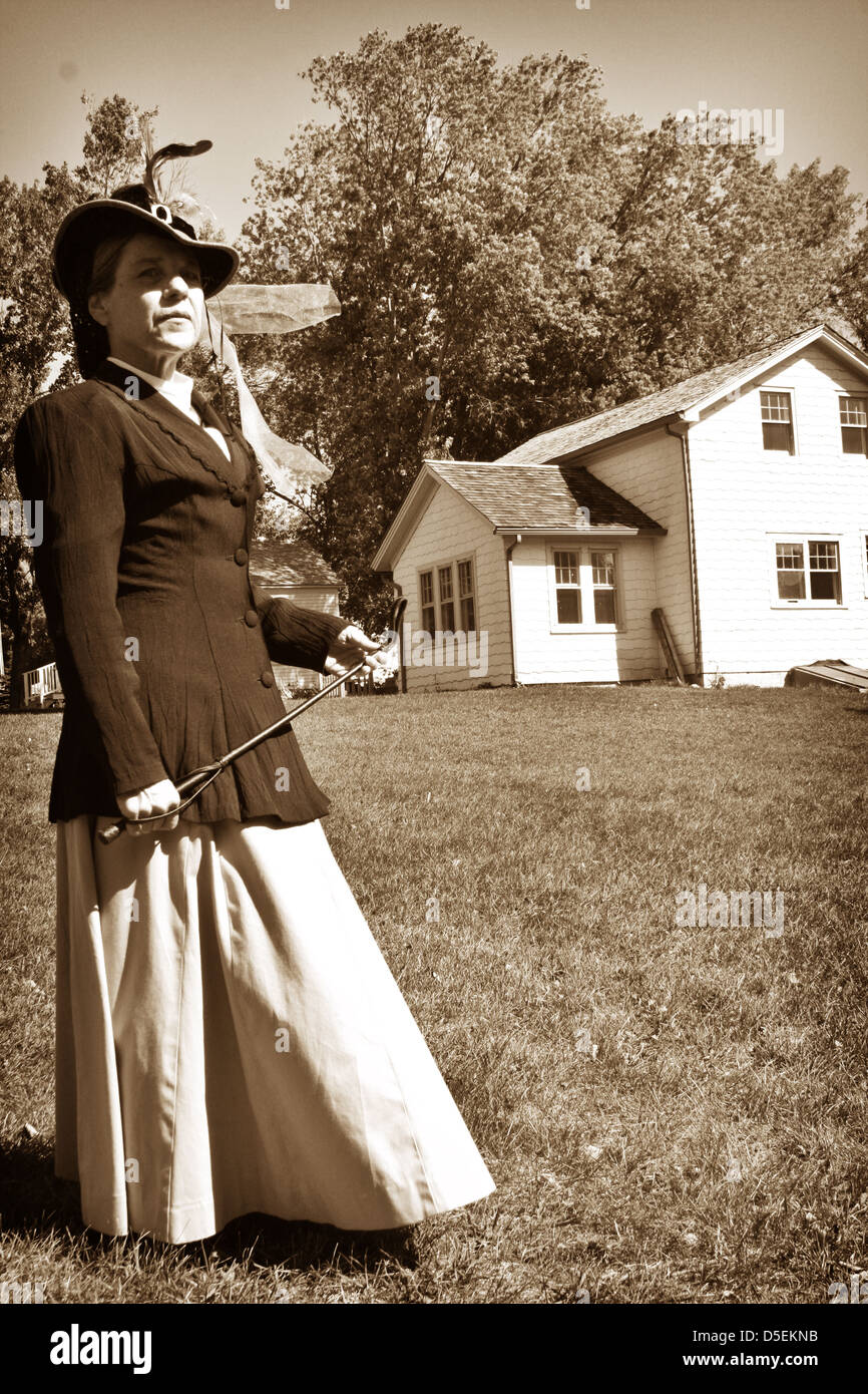 A lady standing in front of her house Stock Photo - Alamy