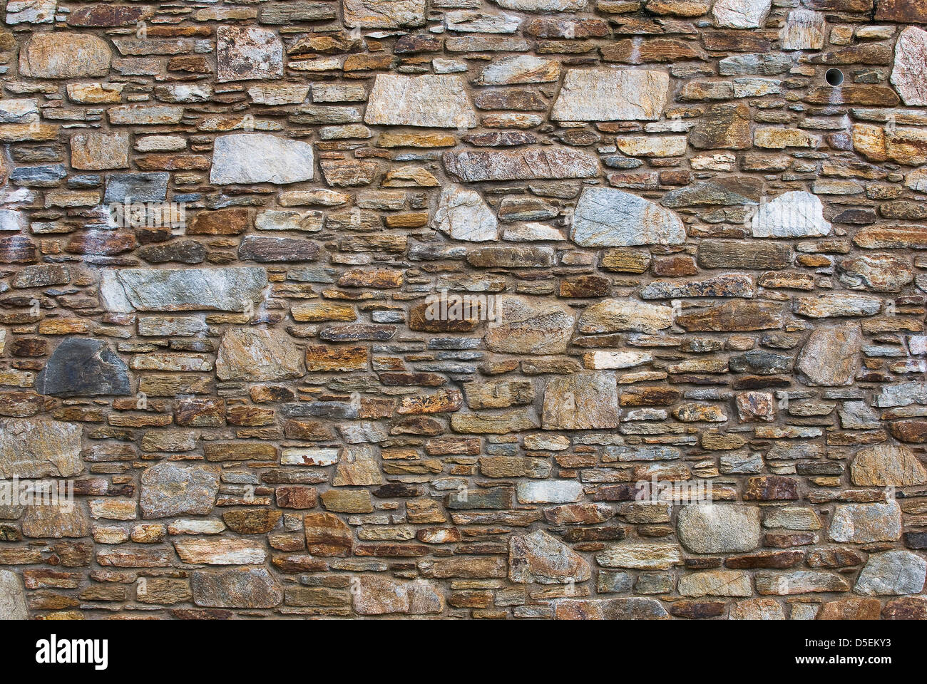 stone wall with different shapes and colors Stock Photo - Alamy