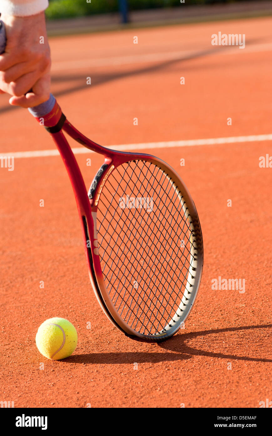 playing tennis on clay course Stock Photo - Alamy