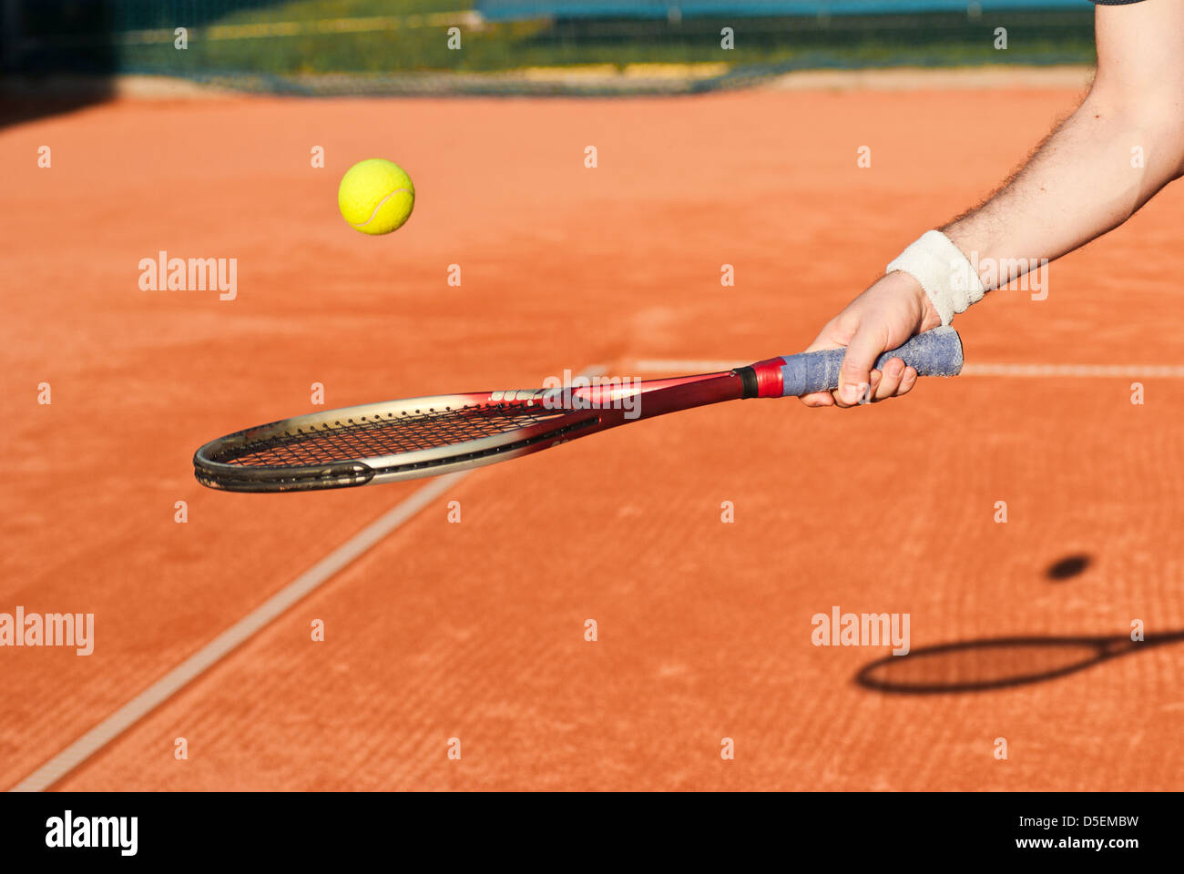 playing tennis on clay course Stock Photo - Alamy