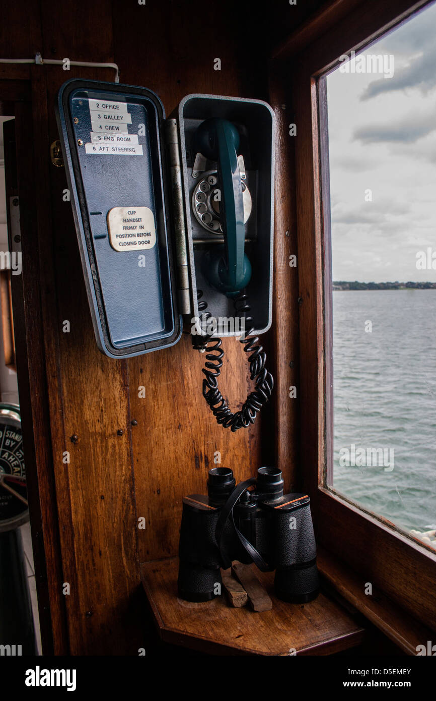 binoculars and telephone on ship's bridge - communication concept Stock ...