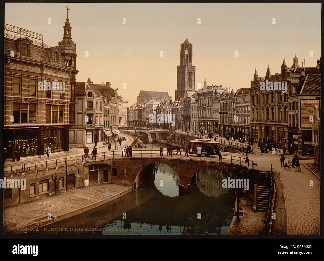 A photograph capturing the Oude Gracht canal and the Bakkerbrug bridge ...