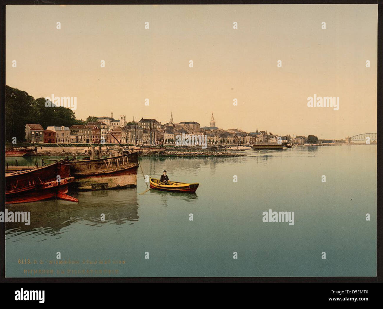 A scenic view of Nymegen, Holland, featuring the Waal River and ...