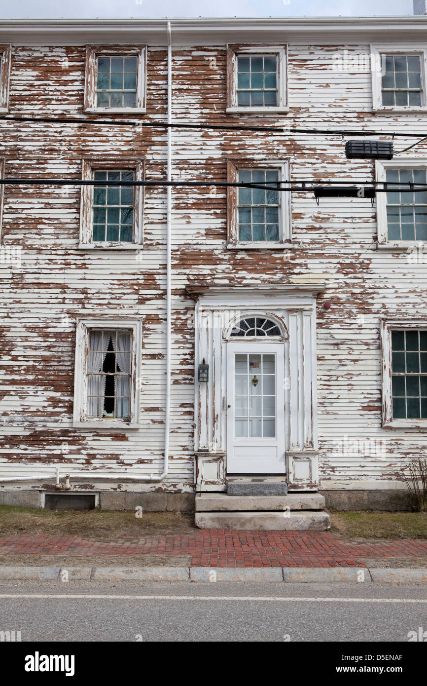 Peeling white paint on side of old timber panelled house called The ...