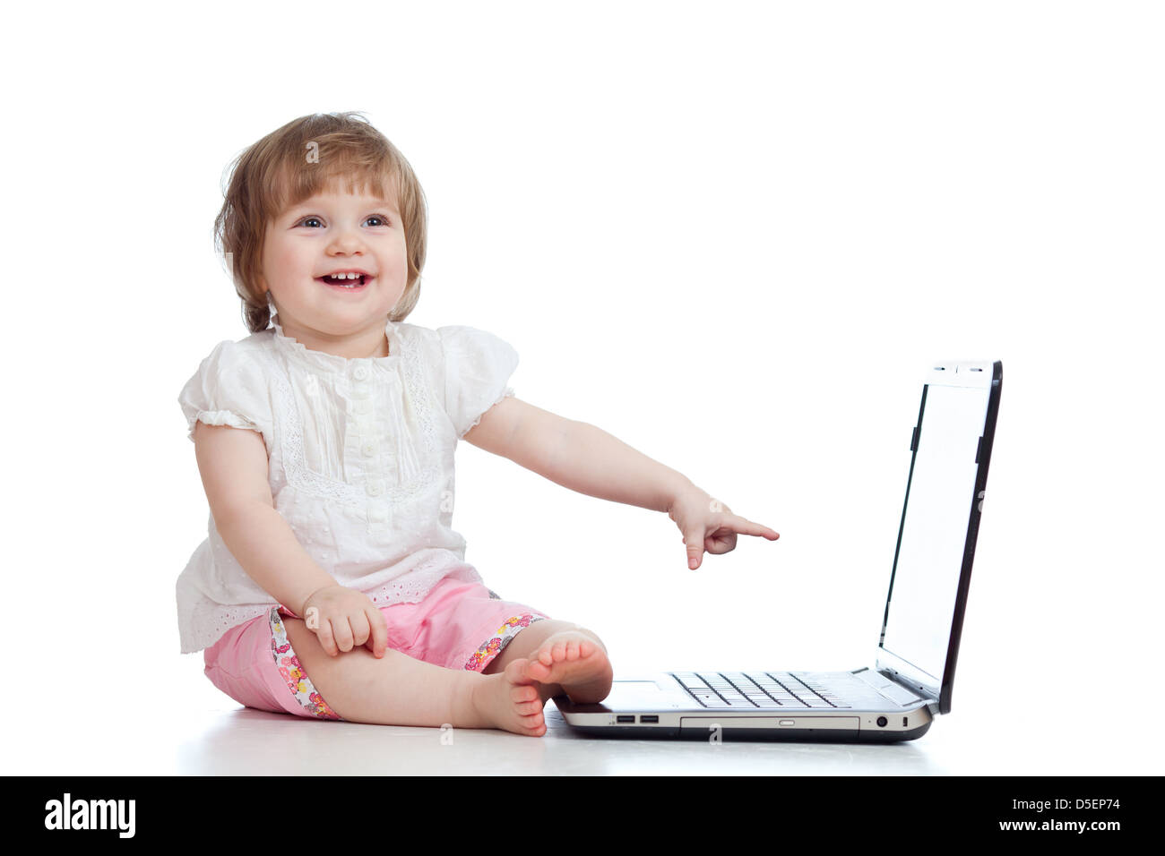 Funny child using a laptop over white background Stock Photo - Alamy