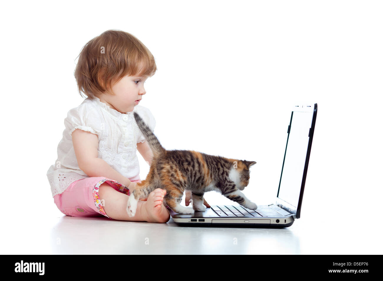 Funny child using a laptop over white background with kitten Stock ...