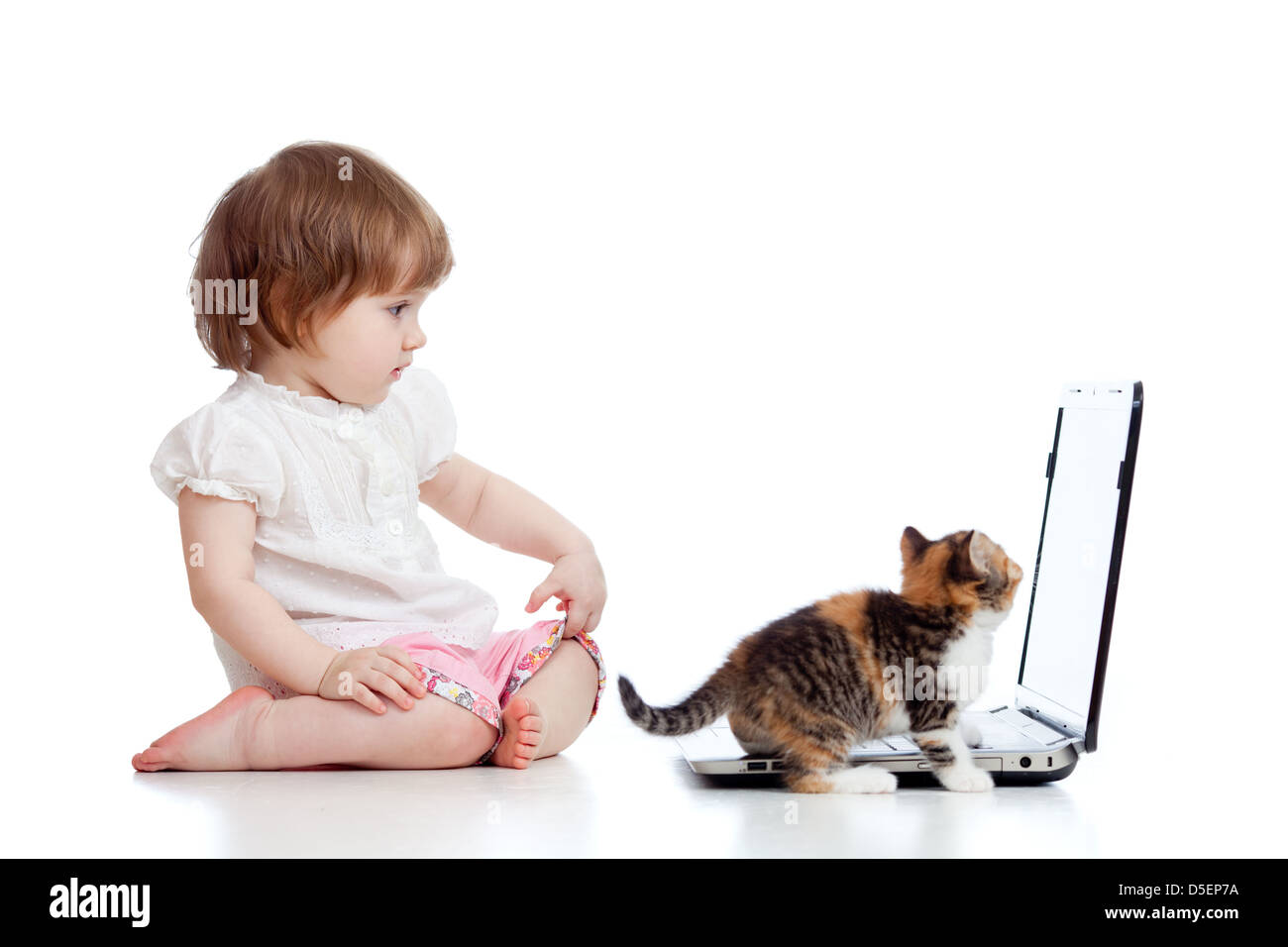 Funny child using a laptop over white background with kitten Stock ...