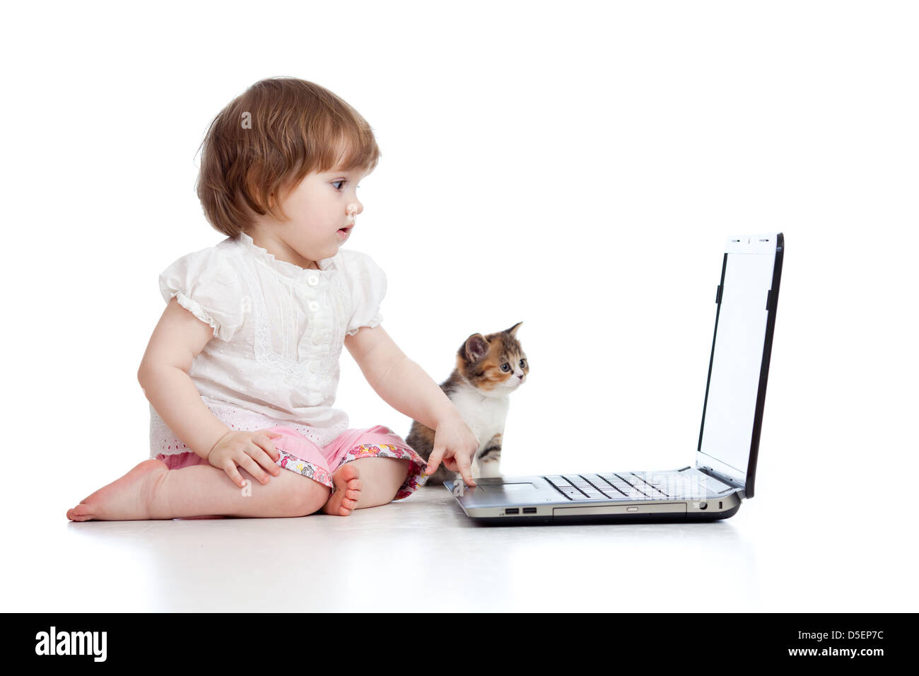 Funny child using a laptop over white background with kitten Stock ...