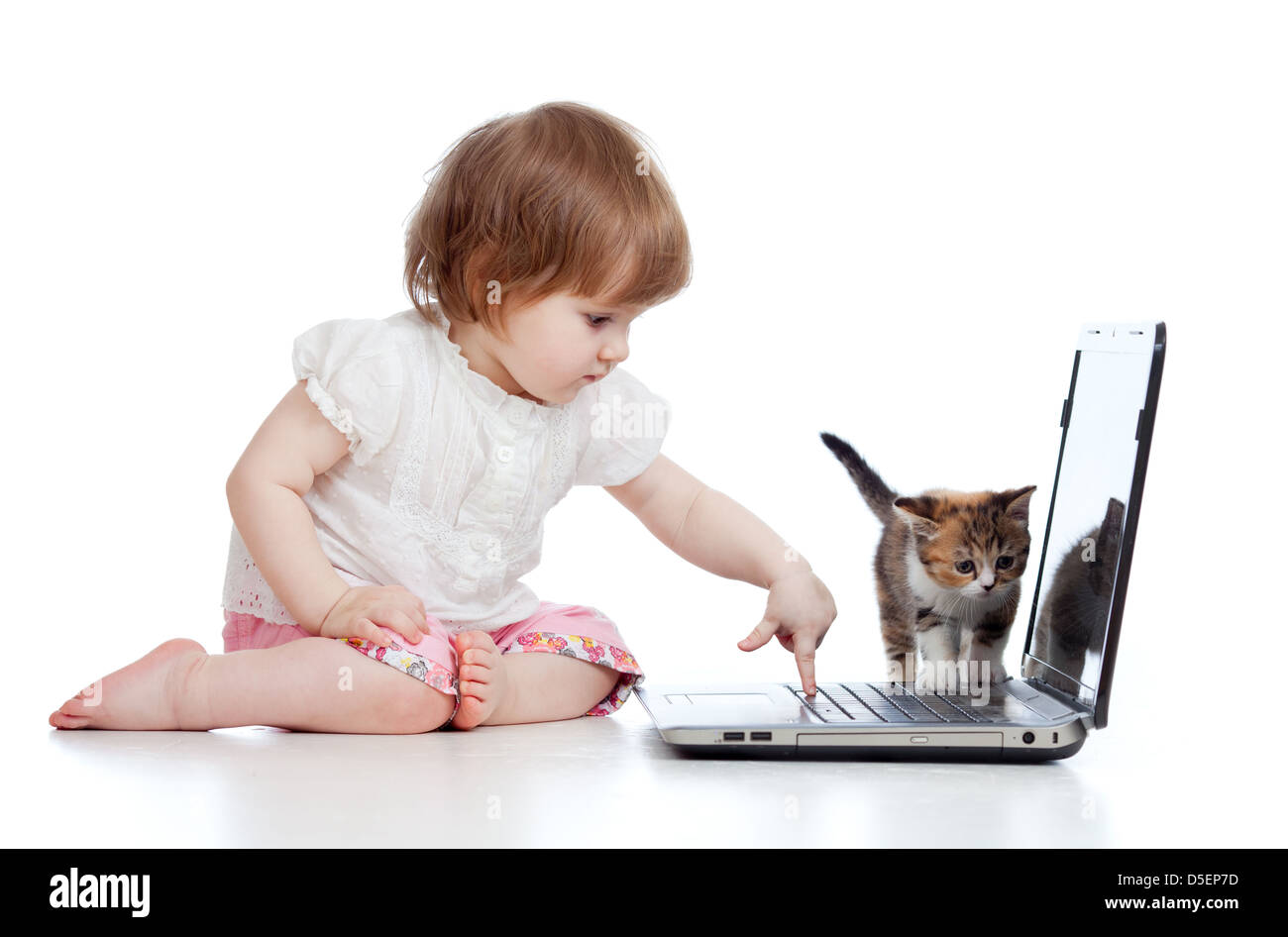 Funny child using a laptop over white background with kitten Stock ...
