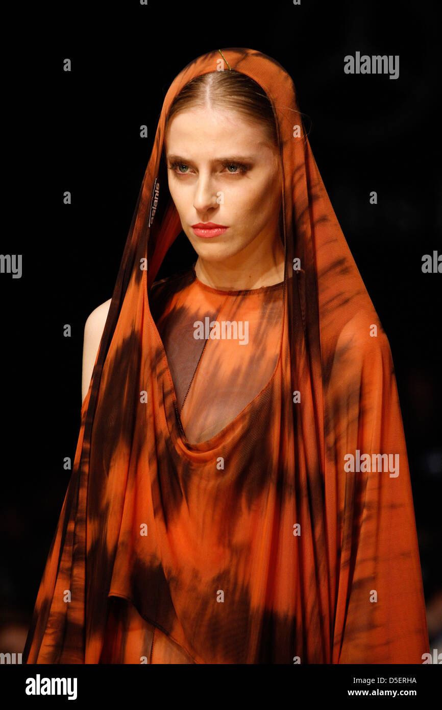 A model displays creations by Aslanis at a catwalk show during the ...