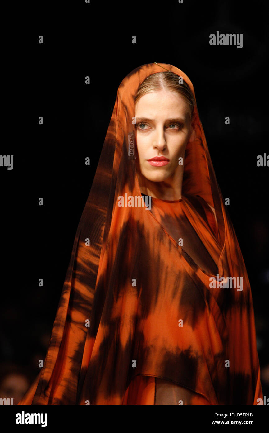 A model displays creations by Aslanis at a catwalk show during the ...