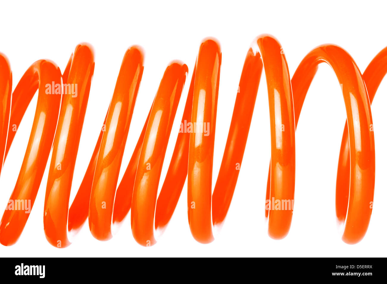 Plastic spring isolated on white background Stock Photo - Alamy