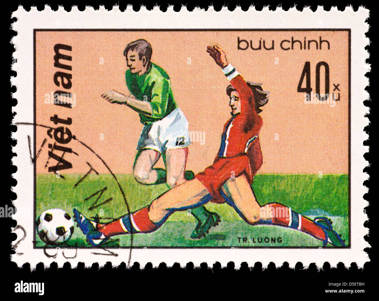 Postage stamp from Vietnam depicting two soccer players Stock Photo - Alamy