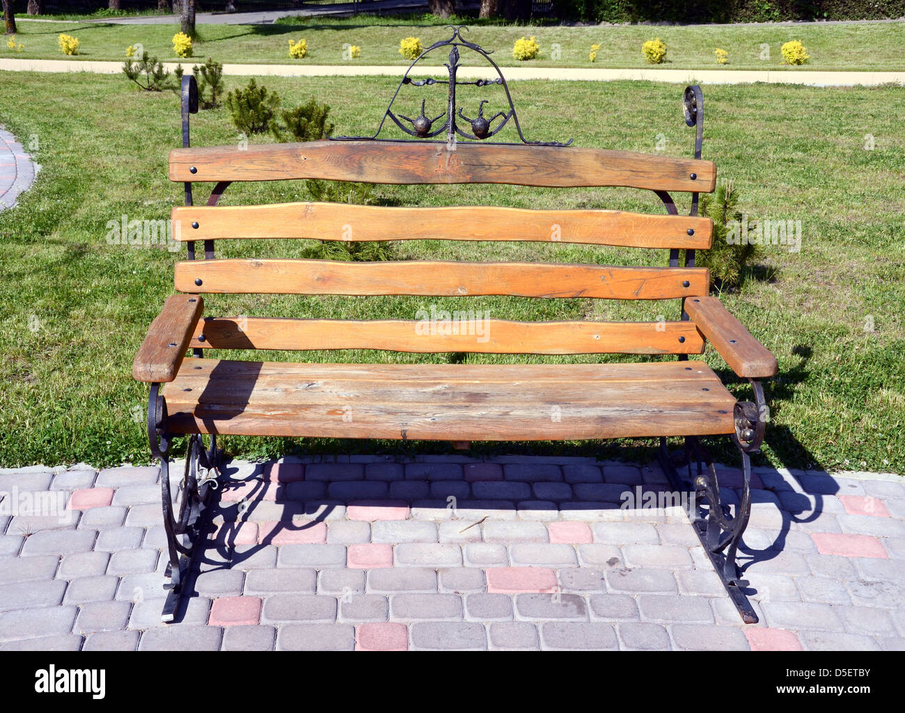 original design wooden bench in city park Stock Photo - Alamy