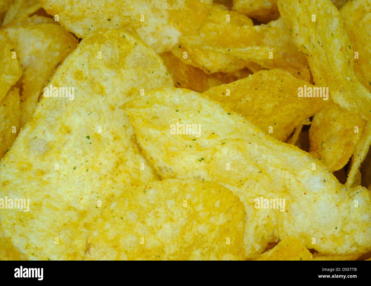 Tomato and garlic flavoured crisps Stock Photo - Alamy