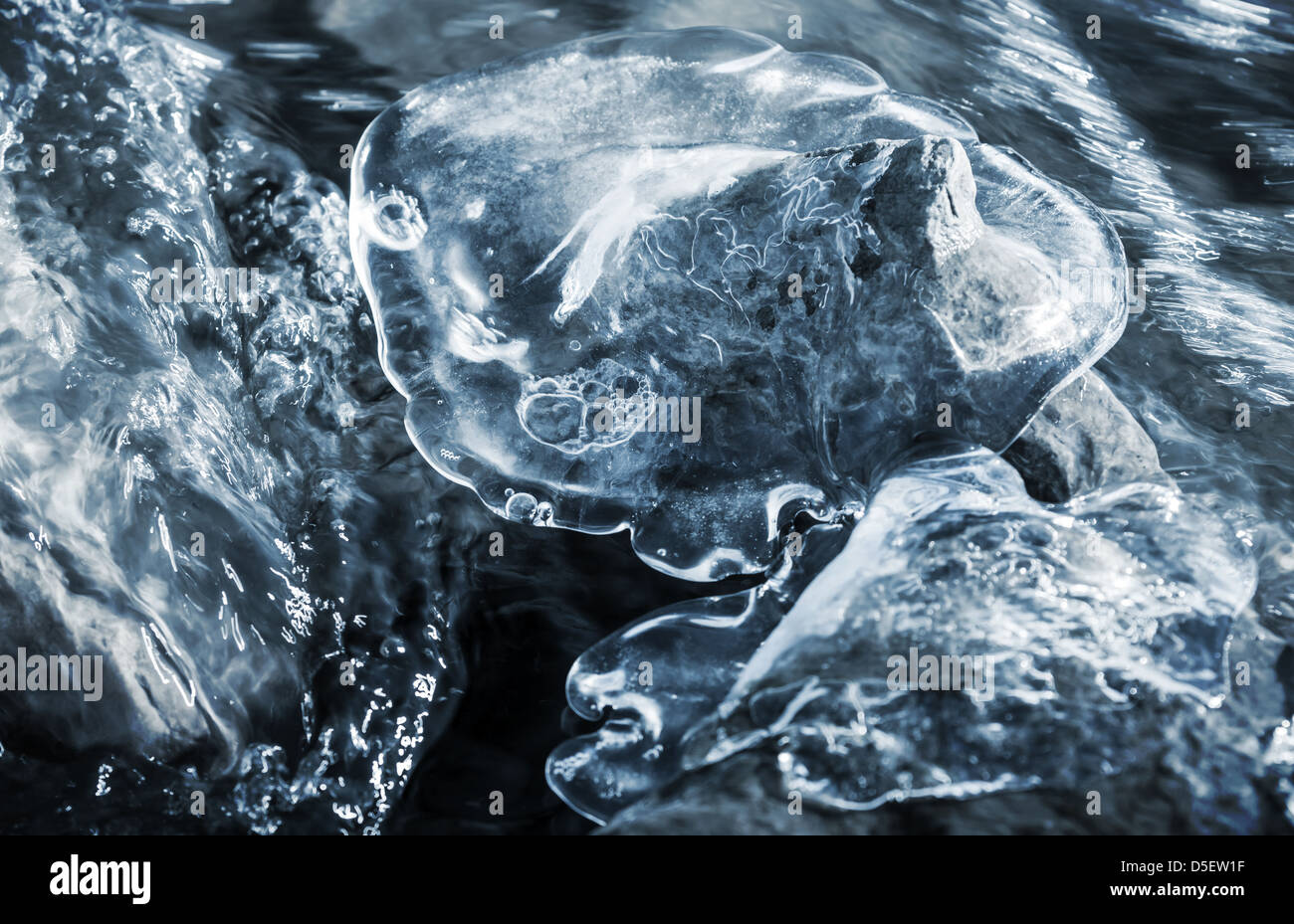 Nature abstract background with spring stream fragment. Water fast ...