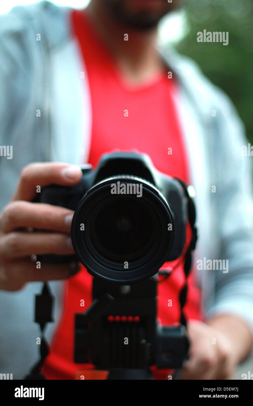 Man filming crouching hi-res stock photography and images - Alamy