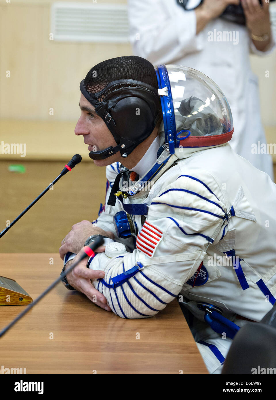 Expedition 35 Flight Engineer Chris Cassidy is seen talking to family ...