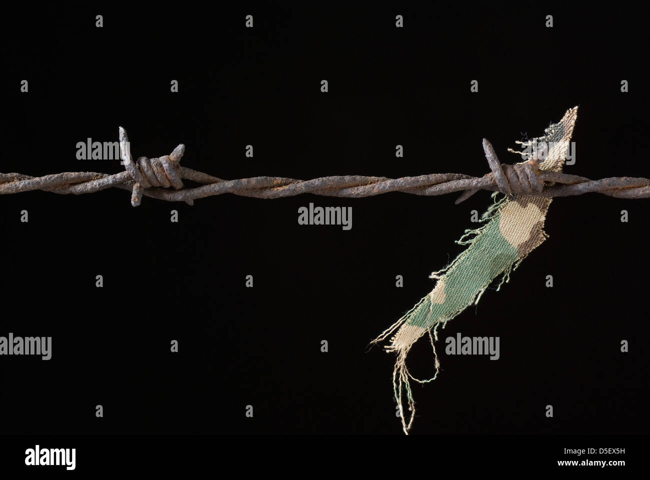 one rusty barbed wire on black background Stock Photo - Alamy