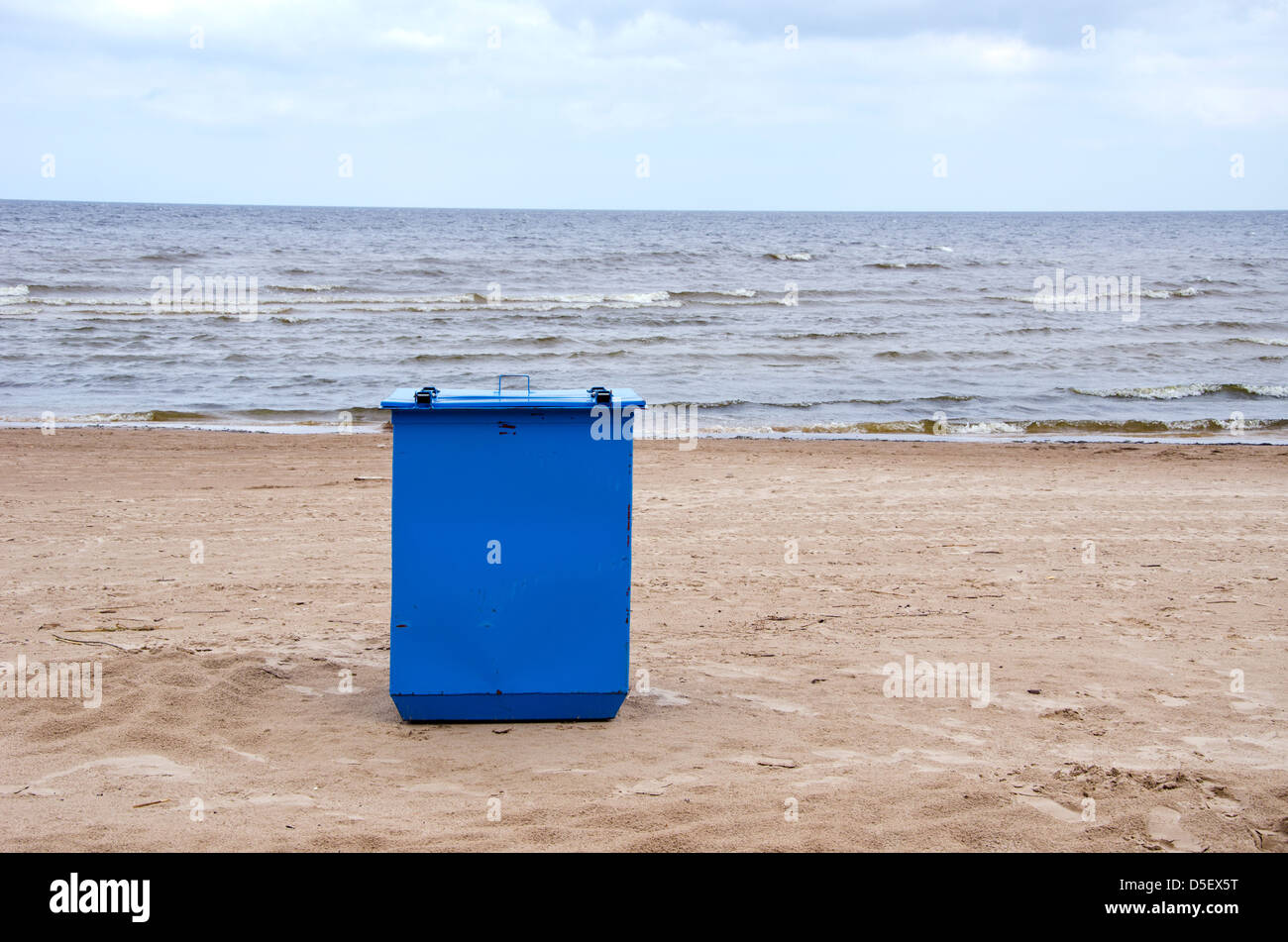 metal garbage container on sea resort beach sand Stock Photo - Alamy