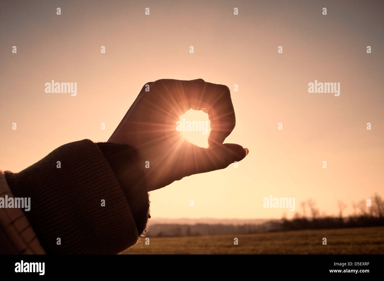 Sun in hand Stock Photo - Alamy