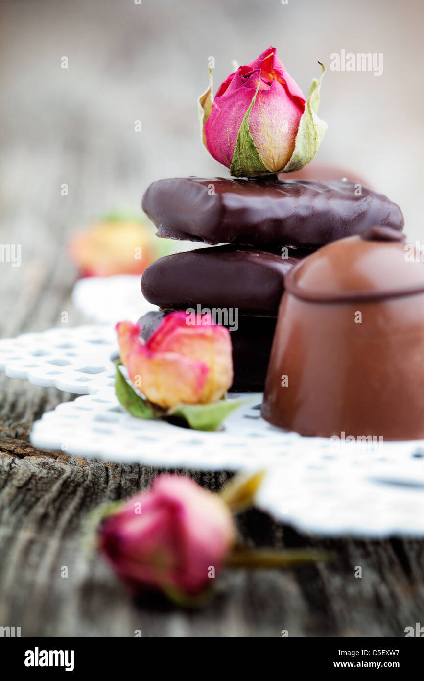 Delicious milk chocolate with dried pink roses Stock Photo - Alamy