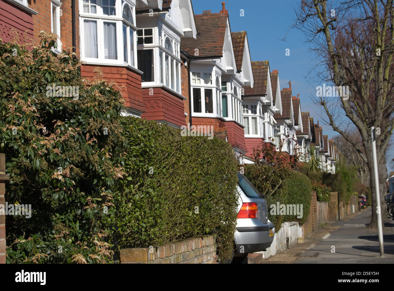 row of edwardian houses in twickenham, middlesex, england, with parked ...
