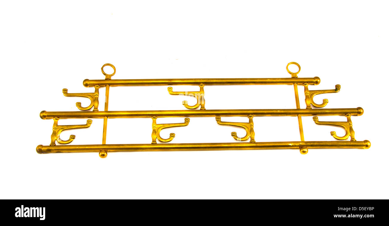 ancient brass hanger isolated on white background Stock Photo - Alamy