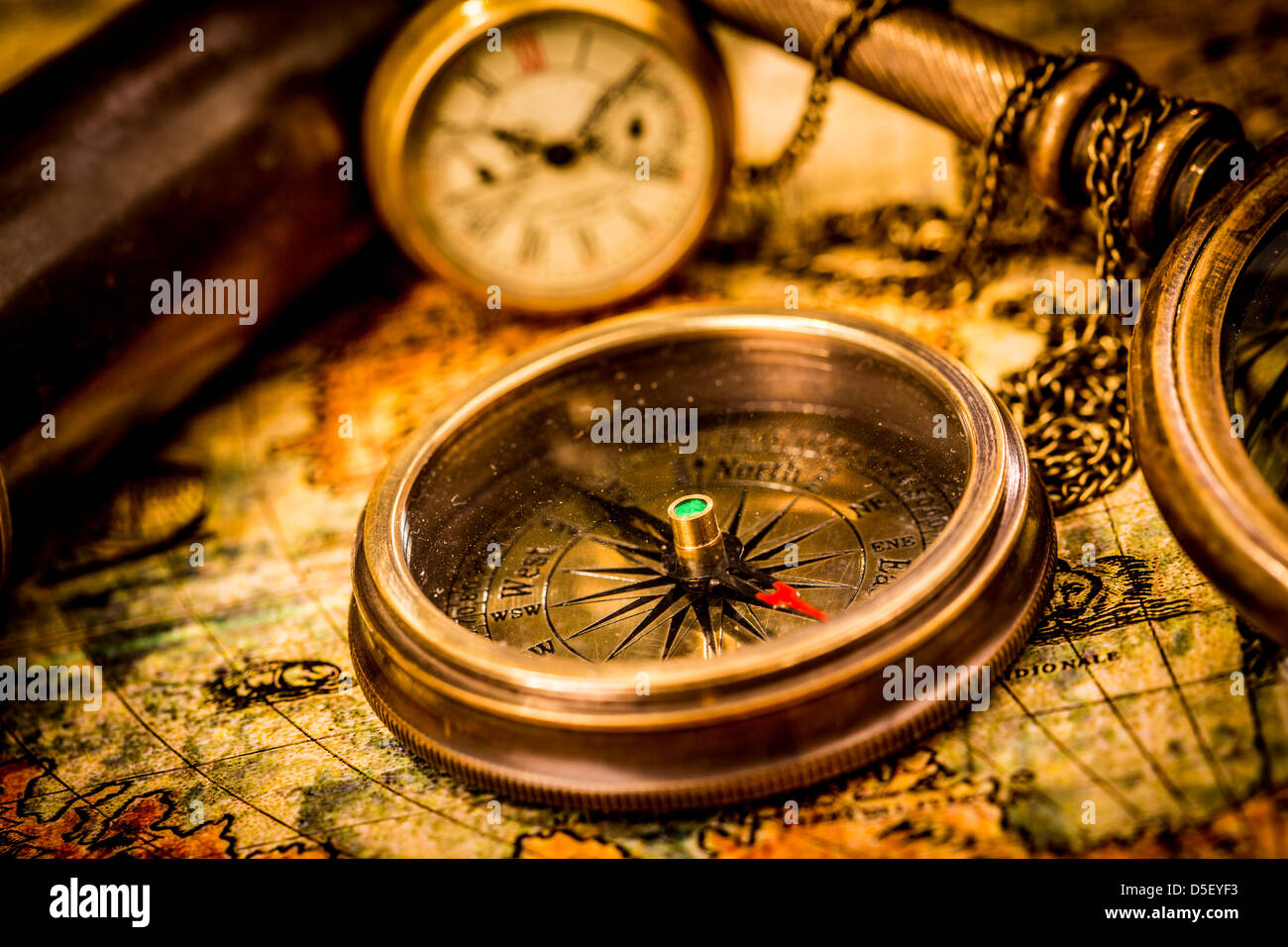 Vintage still life. Vintage compass lies on an ancient world map Stock ...