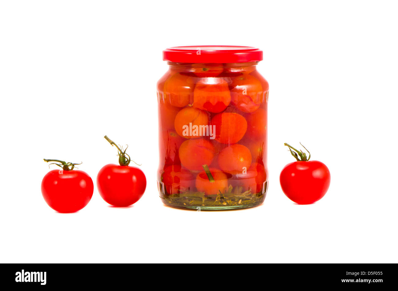 three fresh and potted tomato glass jar isolated on white background ...