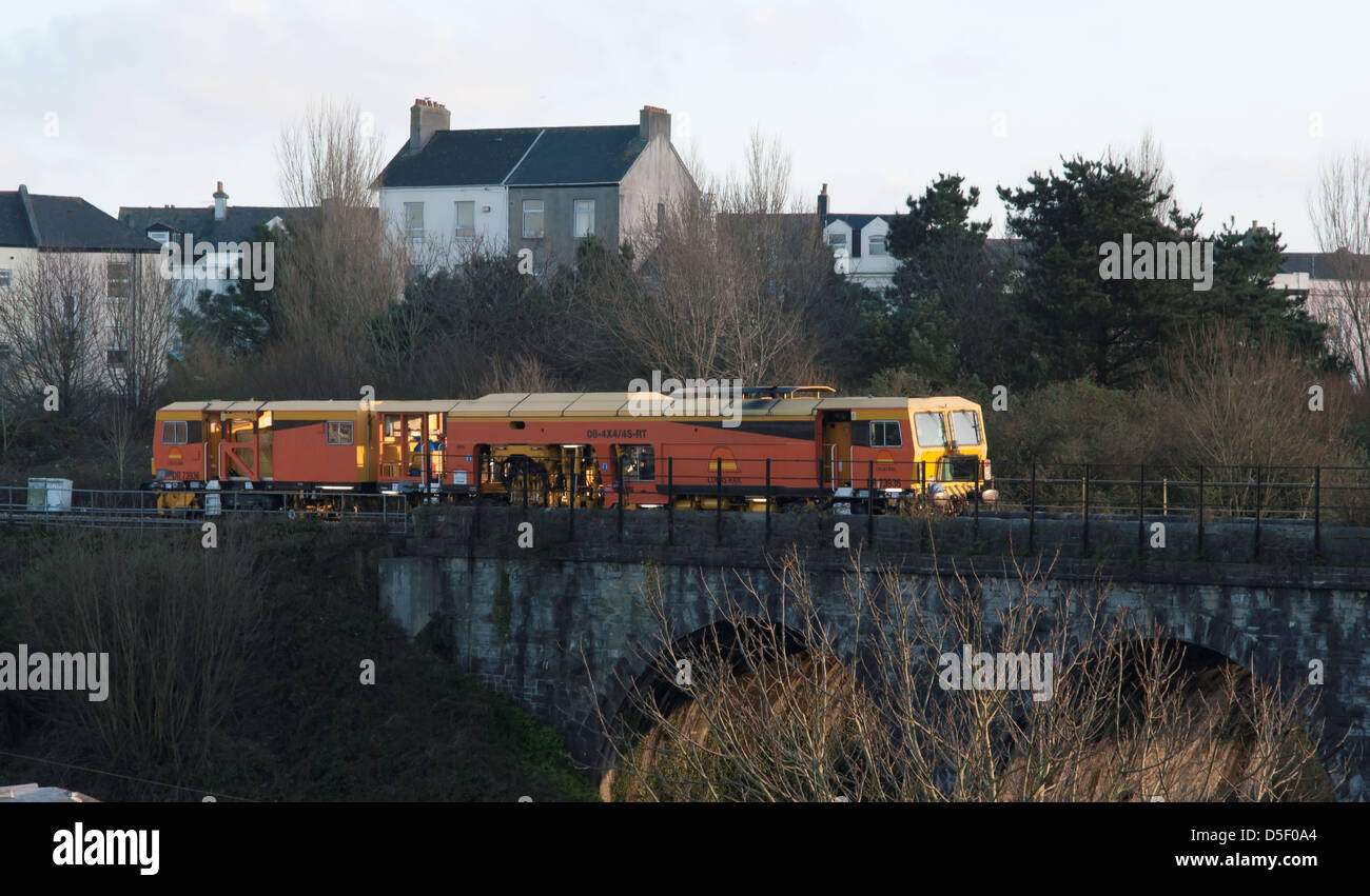 A rail grinding unit at work on railway tracks Stock Photo - Alamy