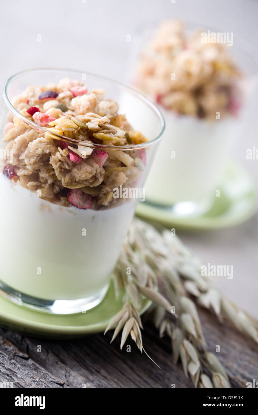 Natural yogurt with muesli in small glass Stock Photo - Alamy