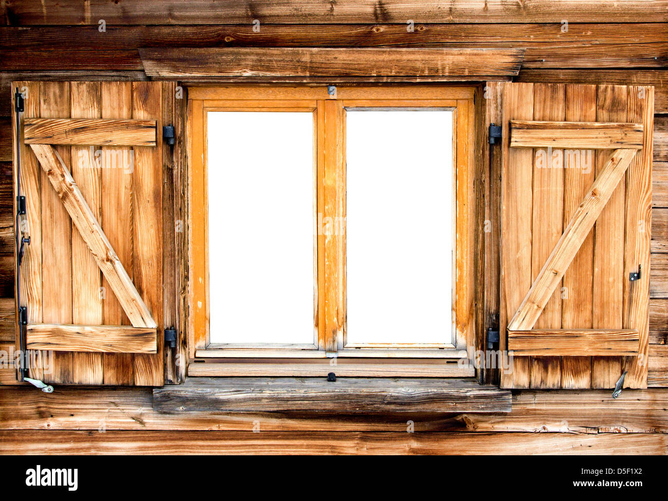 Weathered facade of a mountain hut with isolated windows Stock Photo ...