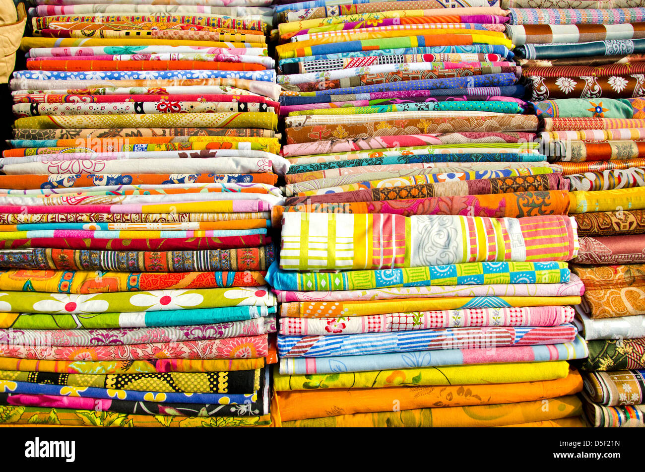 various colorful clothes collection background in Delhi market, India ...