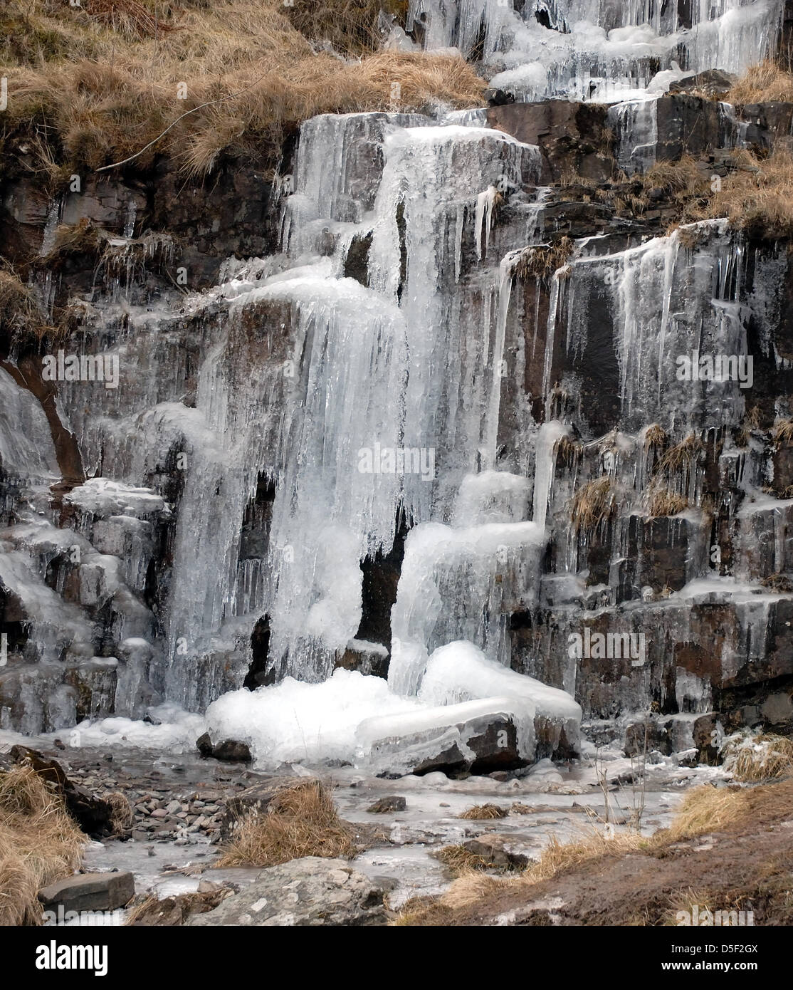 Merthyr Tydfill, UK. 31st March, 2013. A frozen waterfall beside the ...
